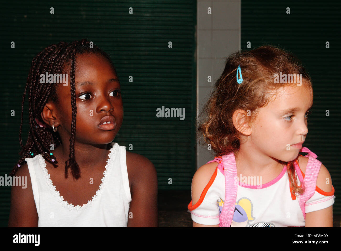 Israel, Tel Aviv two young girls one African and one Caucasian Stock ...