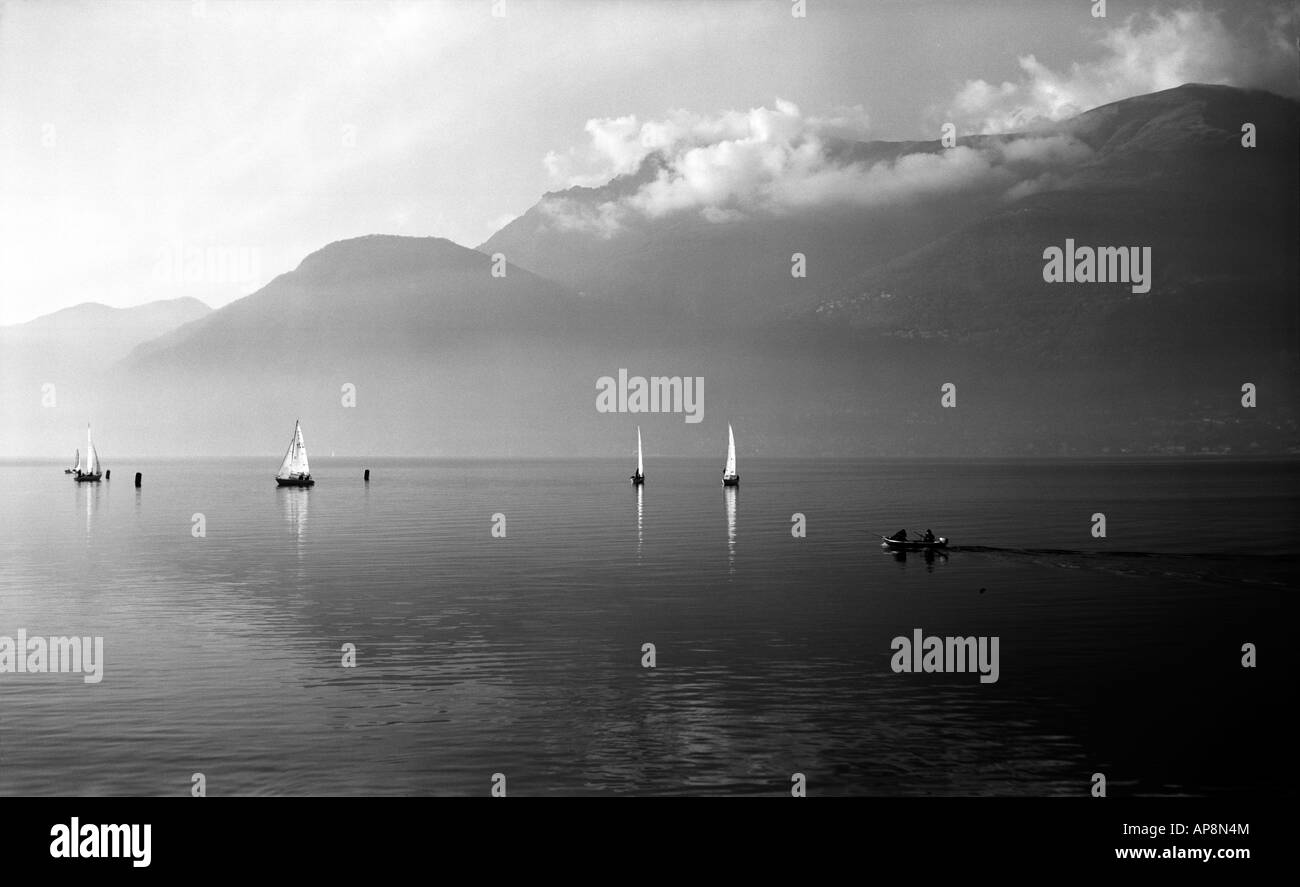 View of the Lario Como Lake with sailing boats with brilliant distance ...