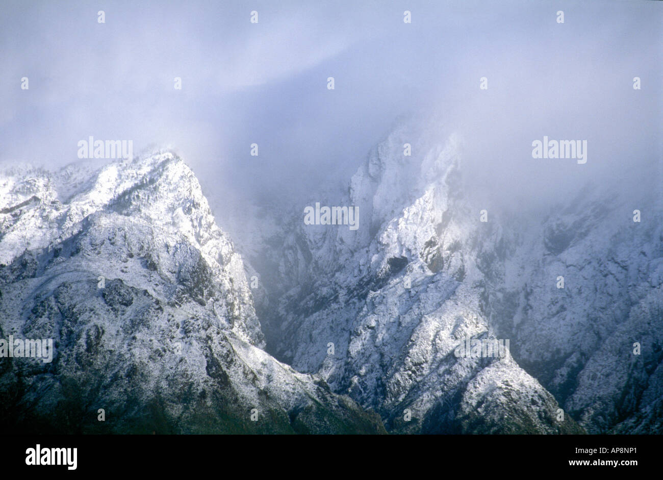 Western Cape Mountains with fresh snow in dramatic moody light South ...