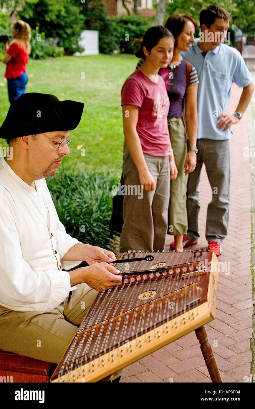 re enactor plays hammer dulcimer a popular Colonial instrument ...