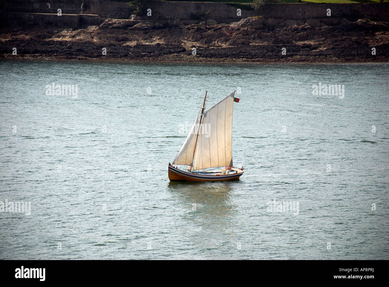 Brightly coloured sailing boat in summer, Devon Stock Photo - Alamy