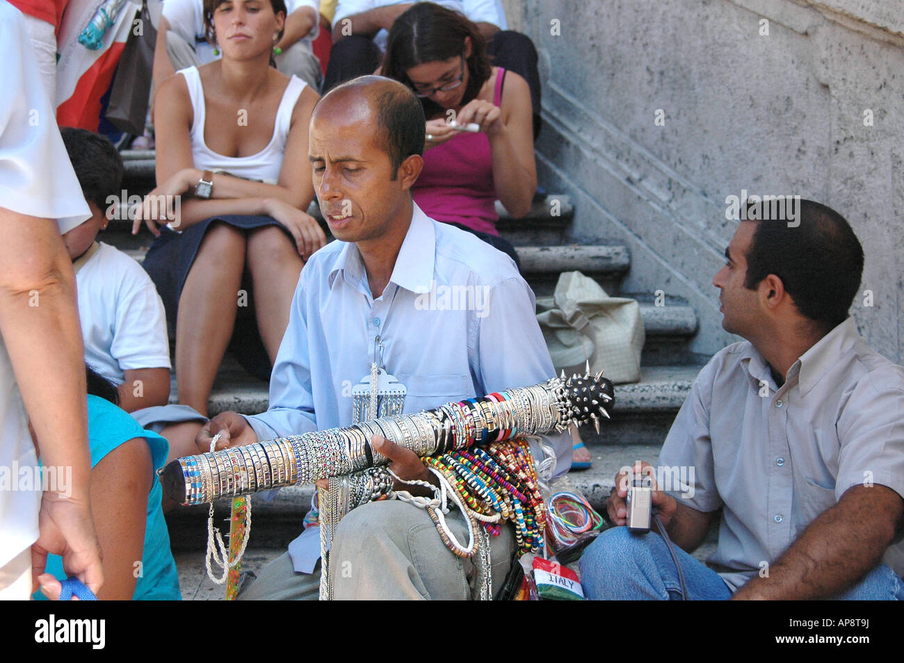 Street jewellery vendor spotted on crowded Piazza di Spagna stairs in ...