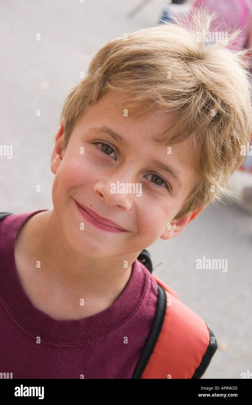 eight year old boy wearing back pack going to school Stock Photo - Alamy