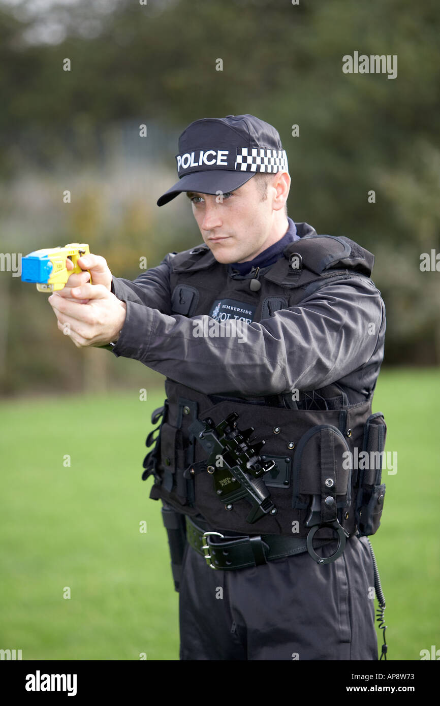 Humberside police firearms officer demonstrates the Taser gun Stock ...