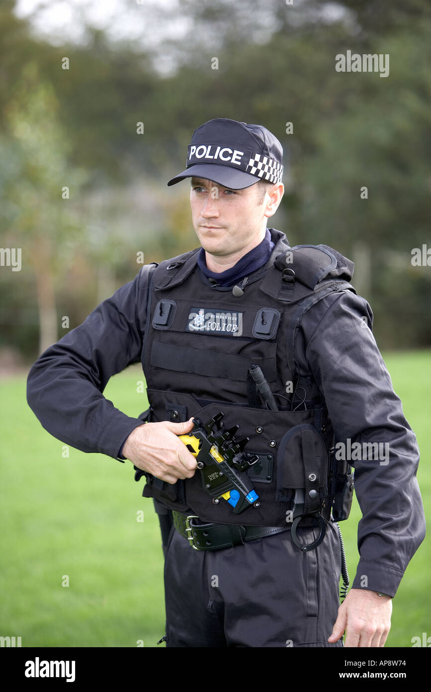 Humberside police firearms officer PC Paul Walker demonstrates the ...