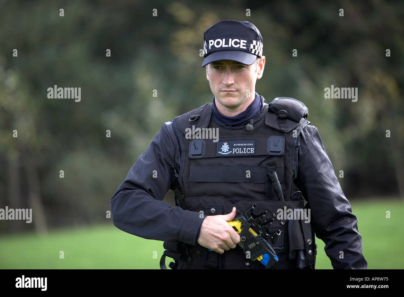 Humberside police firearms officer demonstrates the Taser gun. The X26 ...