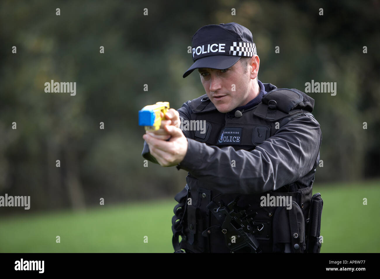 Humberside police firearms officer demonstrates the Taser gun Stock ...
