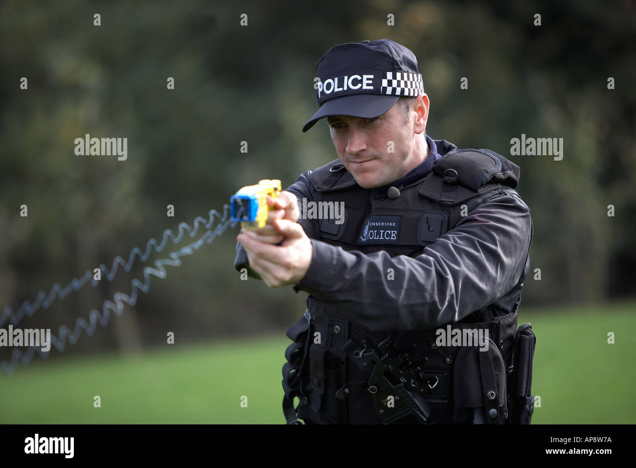 Humberside police firearms officer demonstrates the Taser gun. The X26 ...