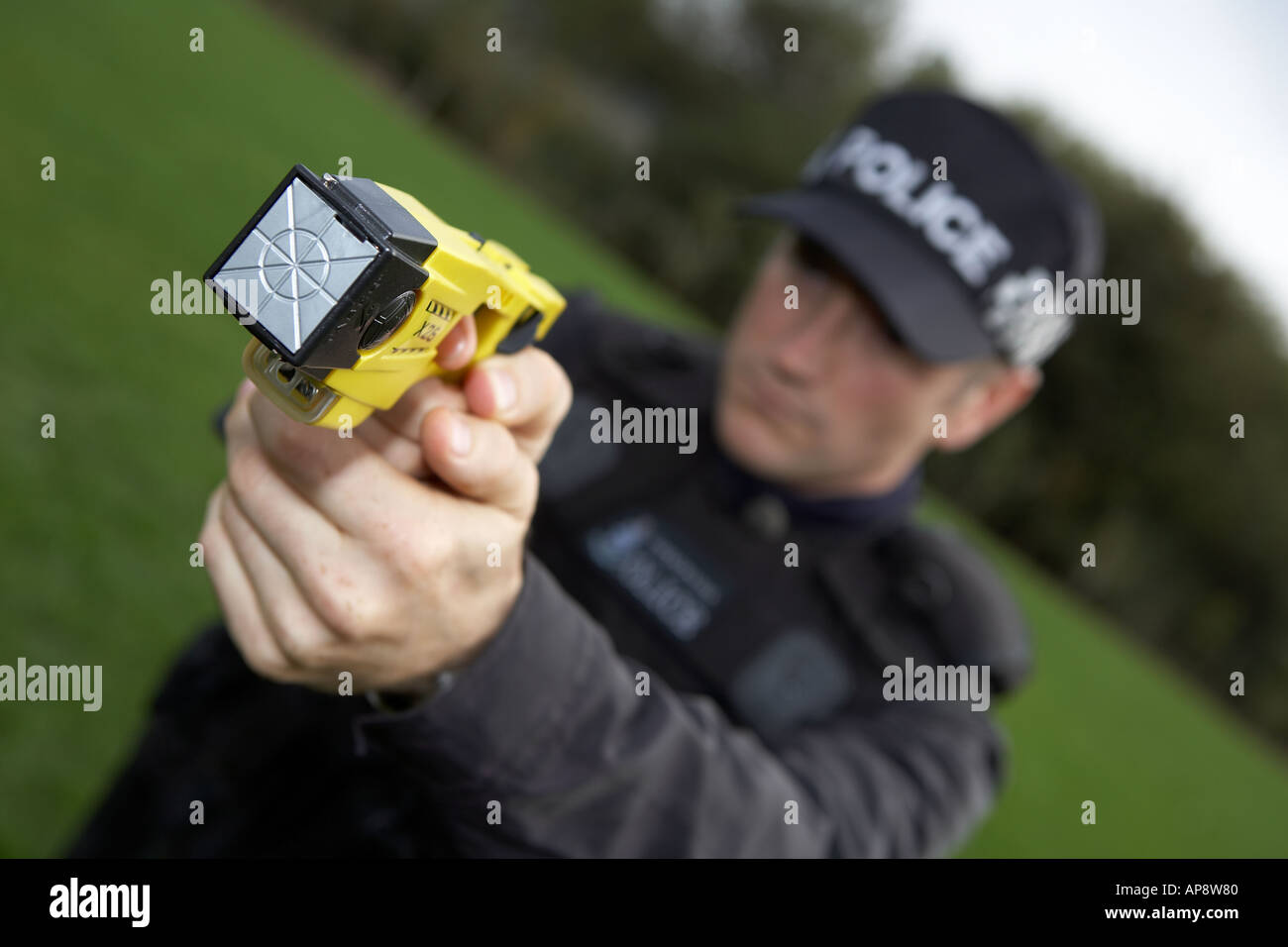 Humberside Police Firearms Officer Demonstrates The Taser Gun Stock
