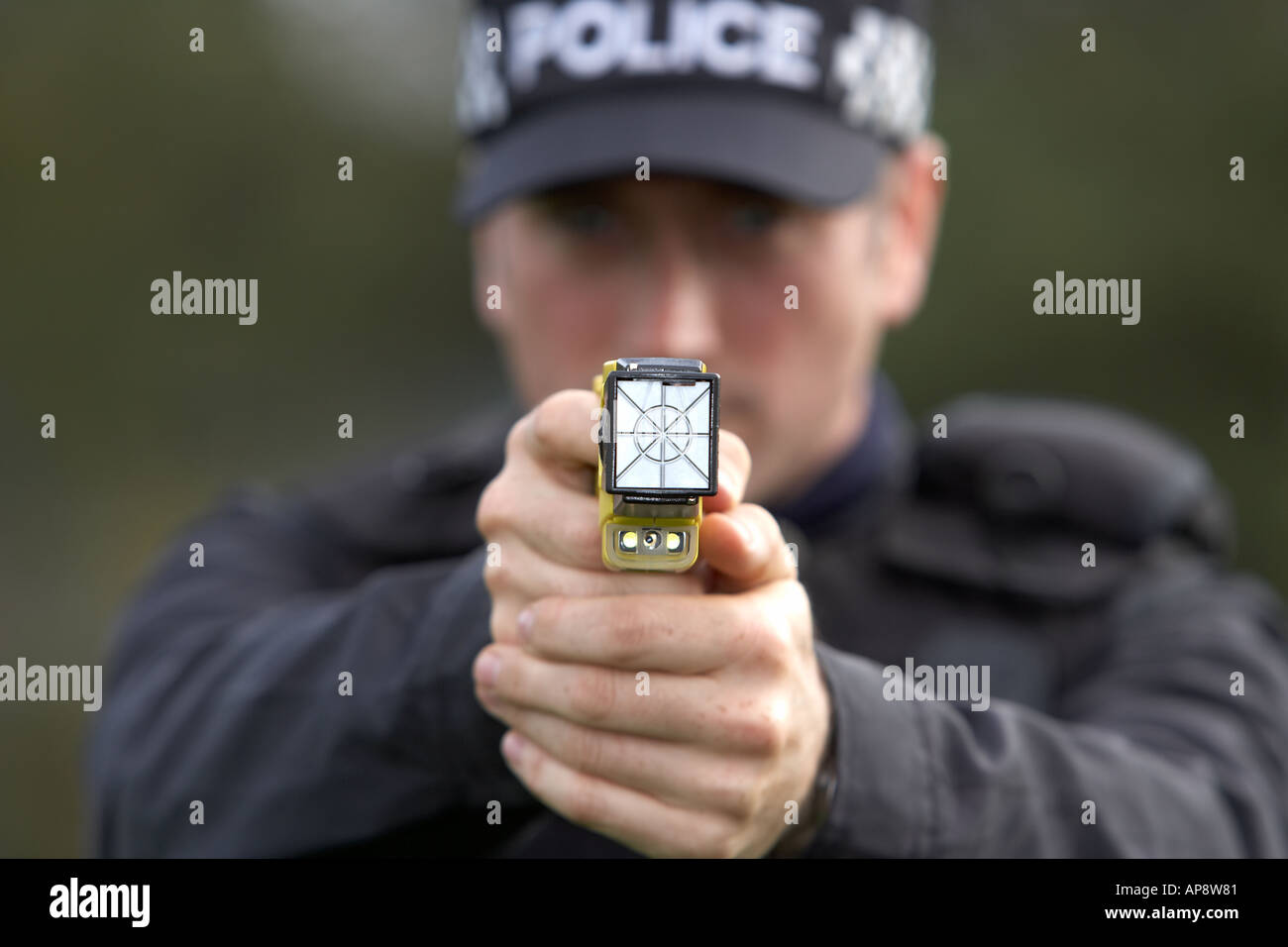 Humberside police firearms officer demonstrates the Taser gun. The X26 ...