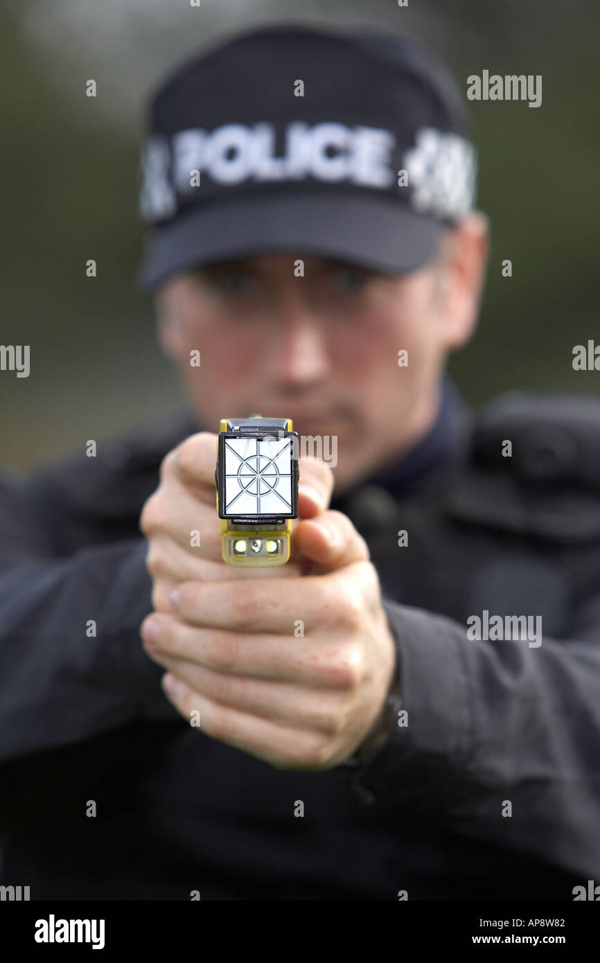 Humberside police firearms officer demonstrates the Taser gun. The X26 ...
