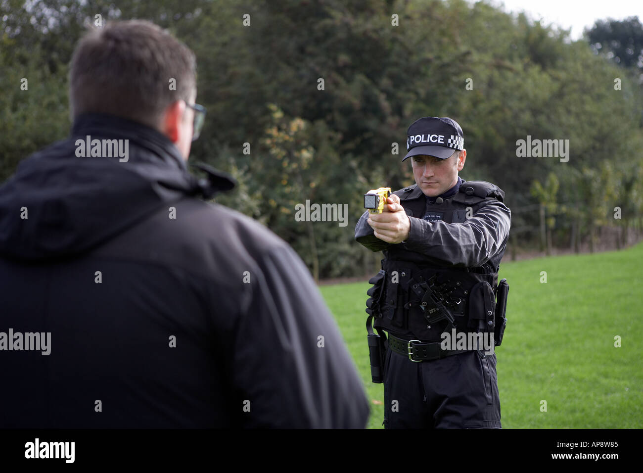 Humberside police firearms officer demonstrates the Taser gun. The X26 ...