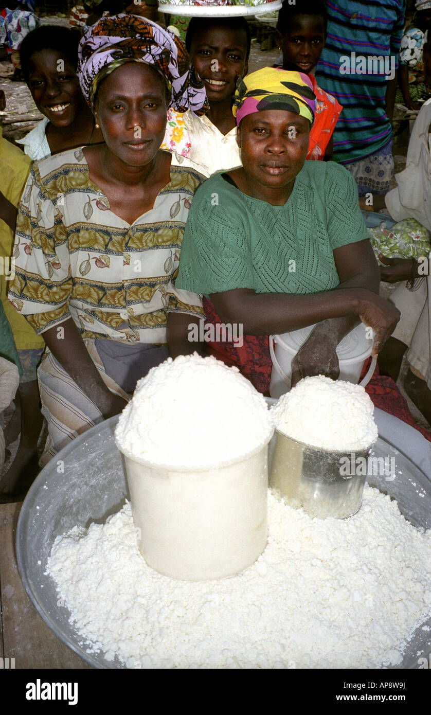 Two black African women selling white maize flour at Ada Junction ...