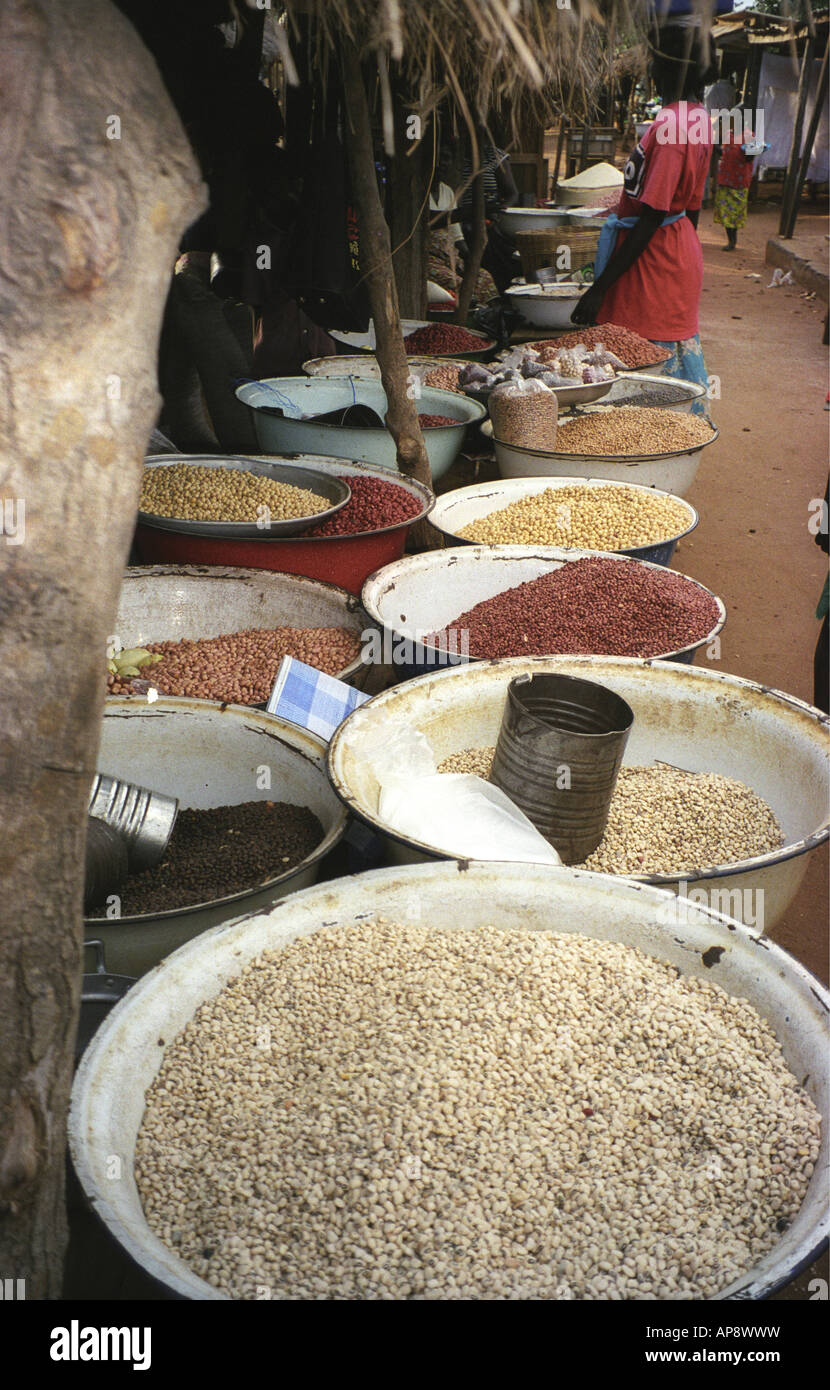Bowls full of various types of beans and legumes offered for sale at ...