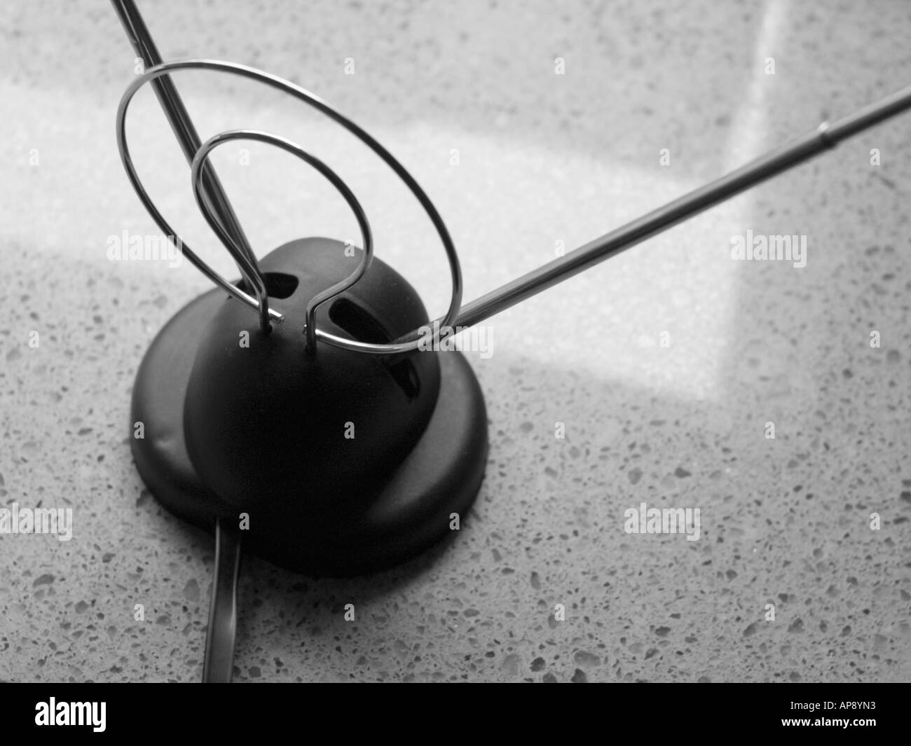 "Rabbit ears" style television antenna in black and white on marble ...