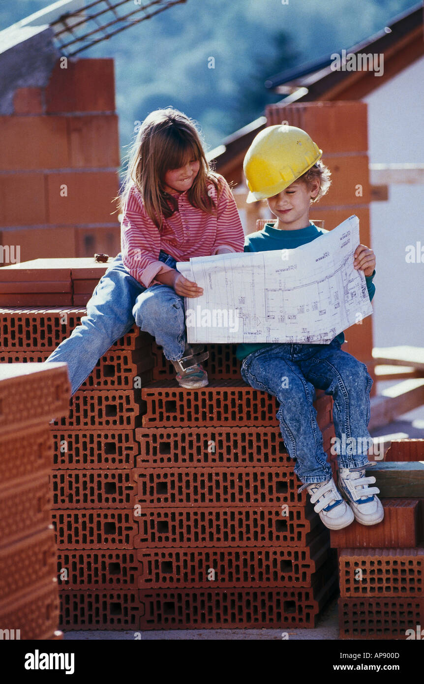 Children holding blueprint Stock Photo - Alamy