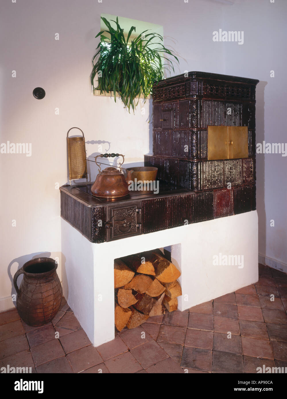 Traditional tiled stove inside house Stock Photo - Alamy