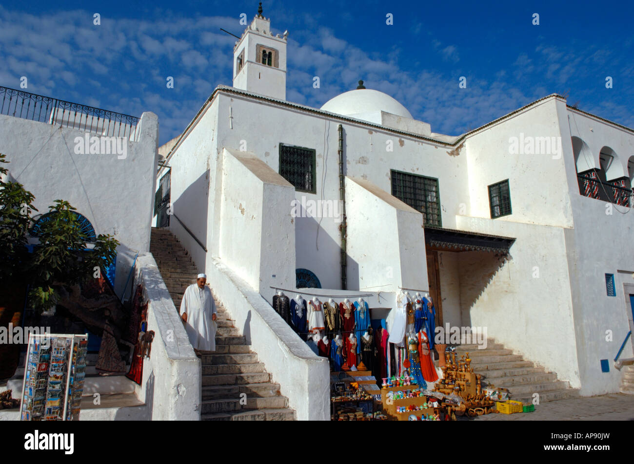 A mullah of Sidi Bou Said descending the steps from his mosque Stock ...