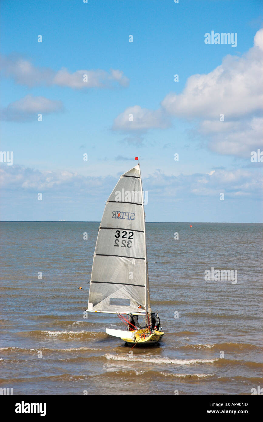 A couple preparing a sailing boat by the waters edge Whitstable Kent ...