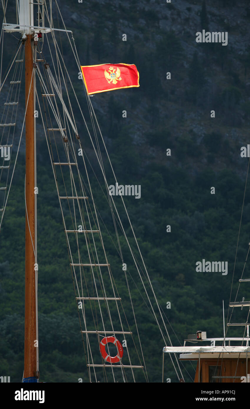 National flag of Montenegro on the ship mast in the Gulf of Kotor (Boka ...