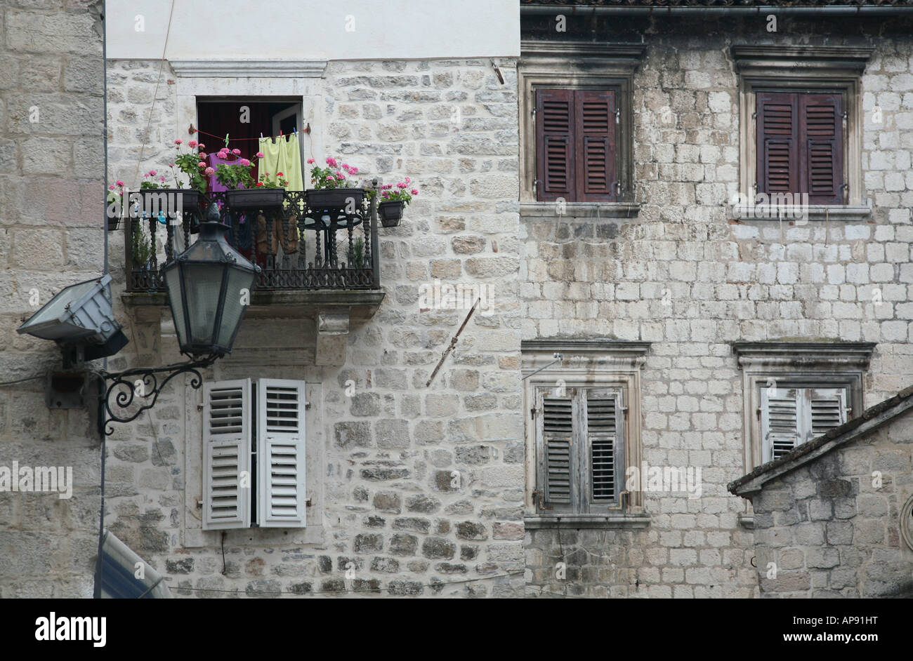 Old lantern balcony and the shuttered windows in the old town of Kotor ...