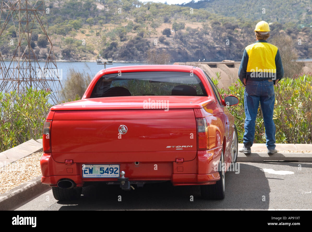 Tradesman/Industrial worker and red utility vehicle Stock Photo - Alamy