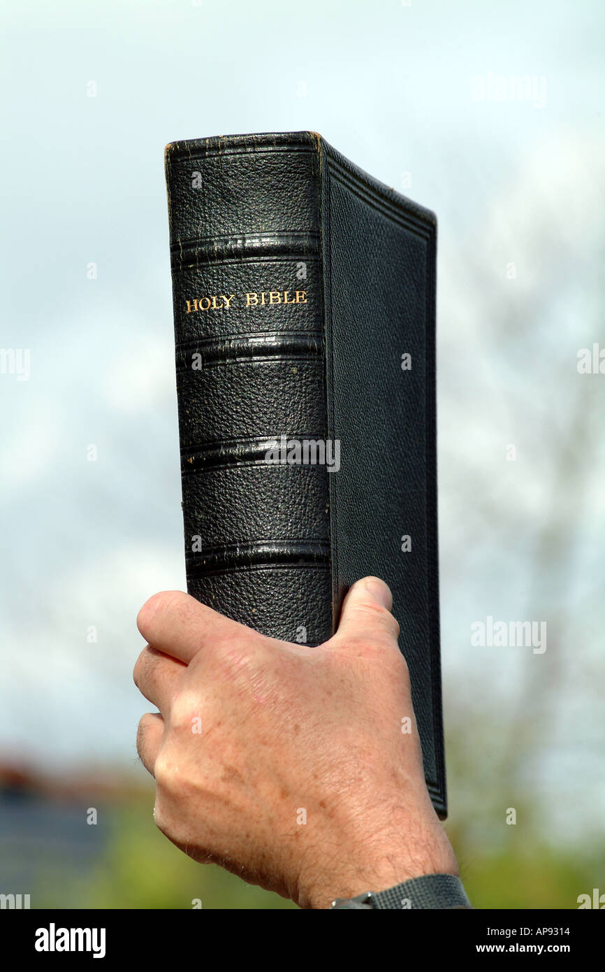 Bible In Hand High Resolution Stock Photography and Images - Alamy