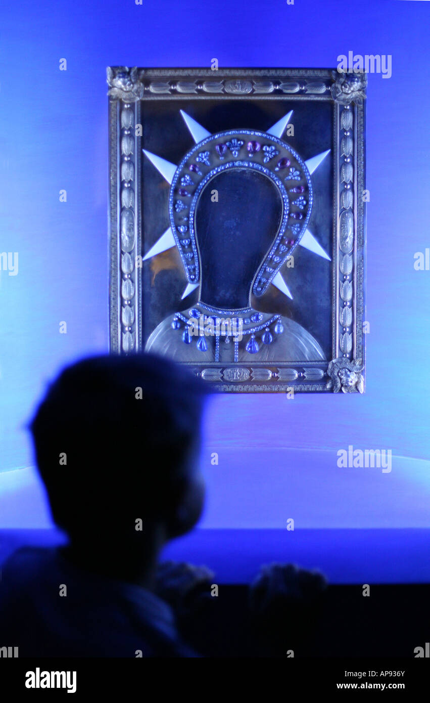 Young visitor looking at the miracle working icon Bogorodica Filermosa ...