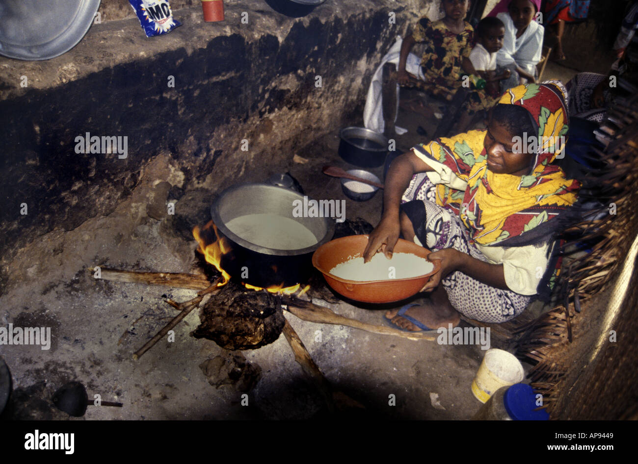 Woman cooking rice inside her hut on Lamu Island Kenya Stock Photo - Alamy