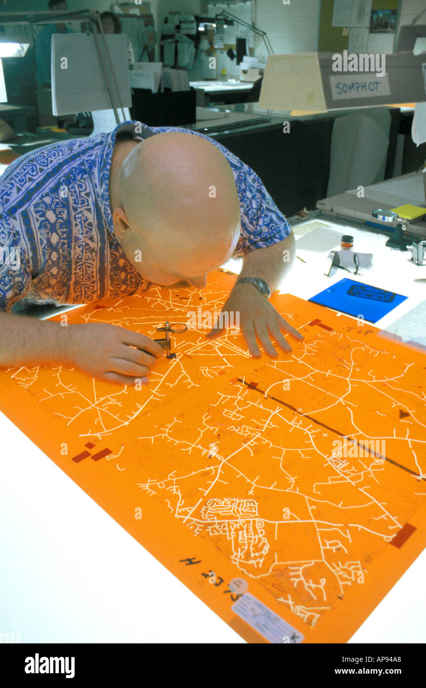 cartographer works on map film maps transparent Stock Photo - Alamy