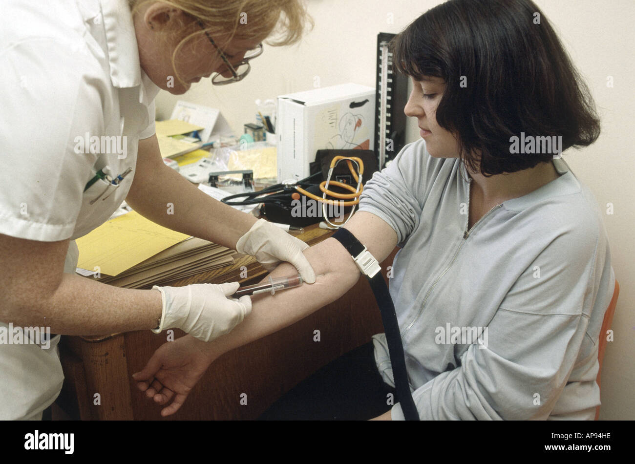 Pregnant woman taking blood sample hi-res stock photography and images ...