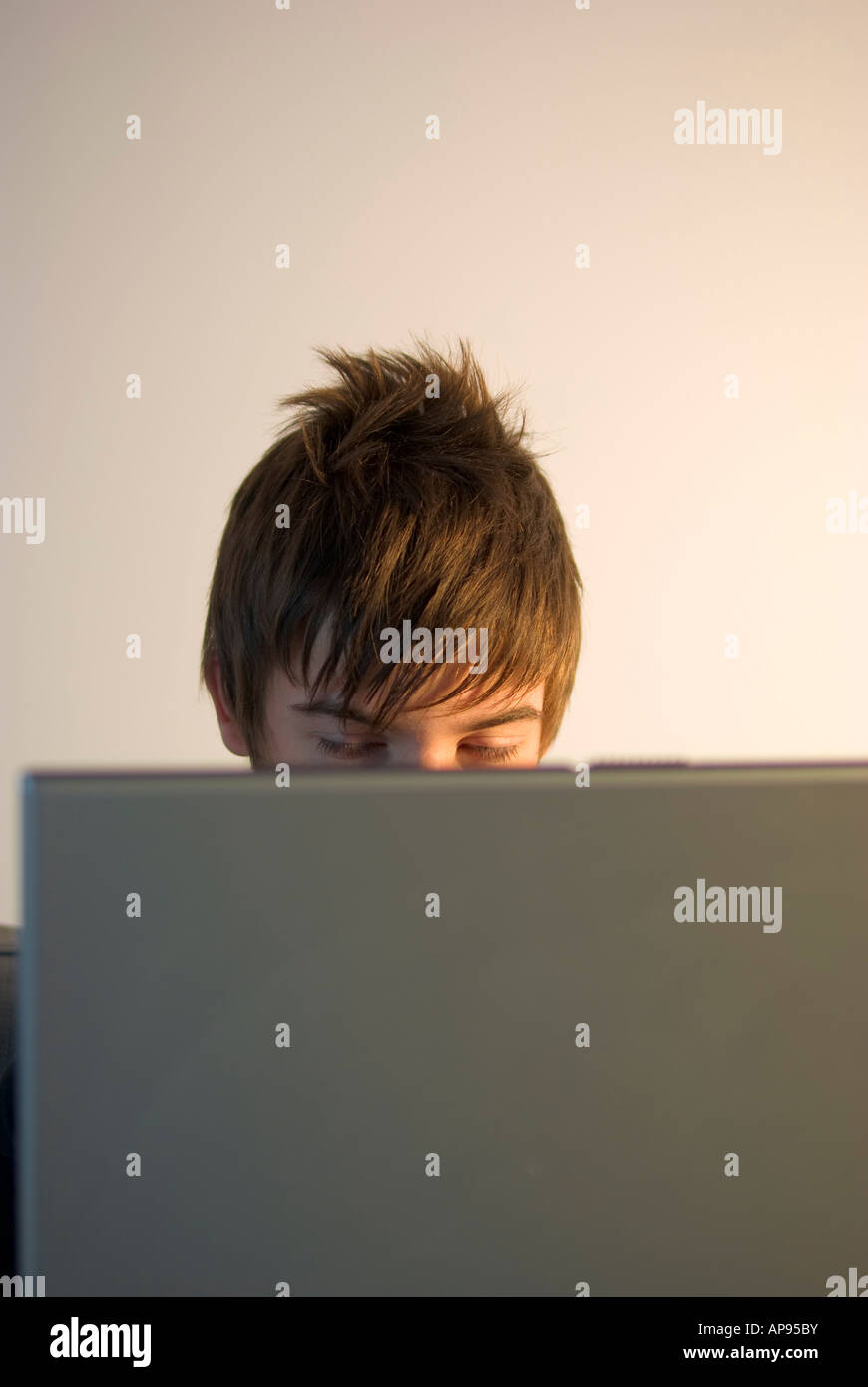 13 year old boy teenager with laptop computer Stock Photo - Alamy