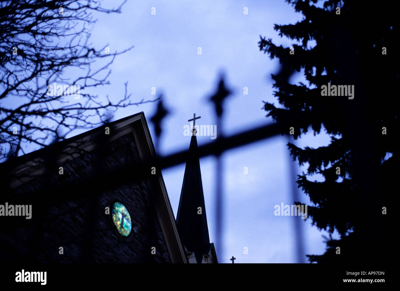 Church steeple seen through a fence Stock Photo - Alamy