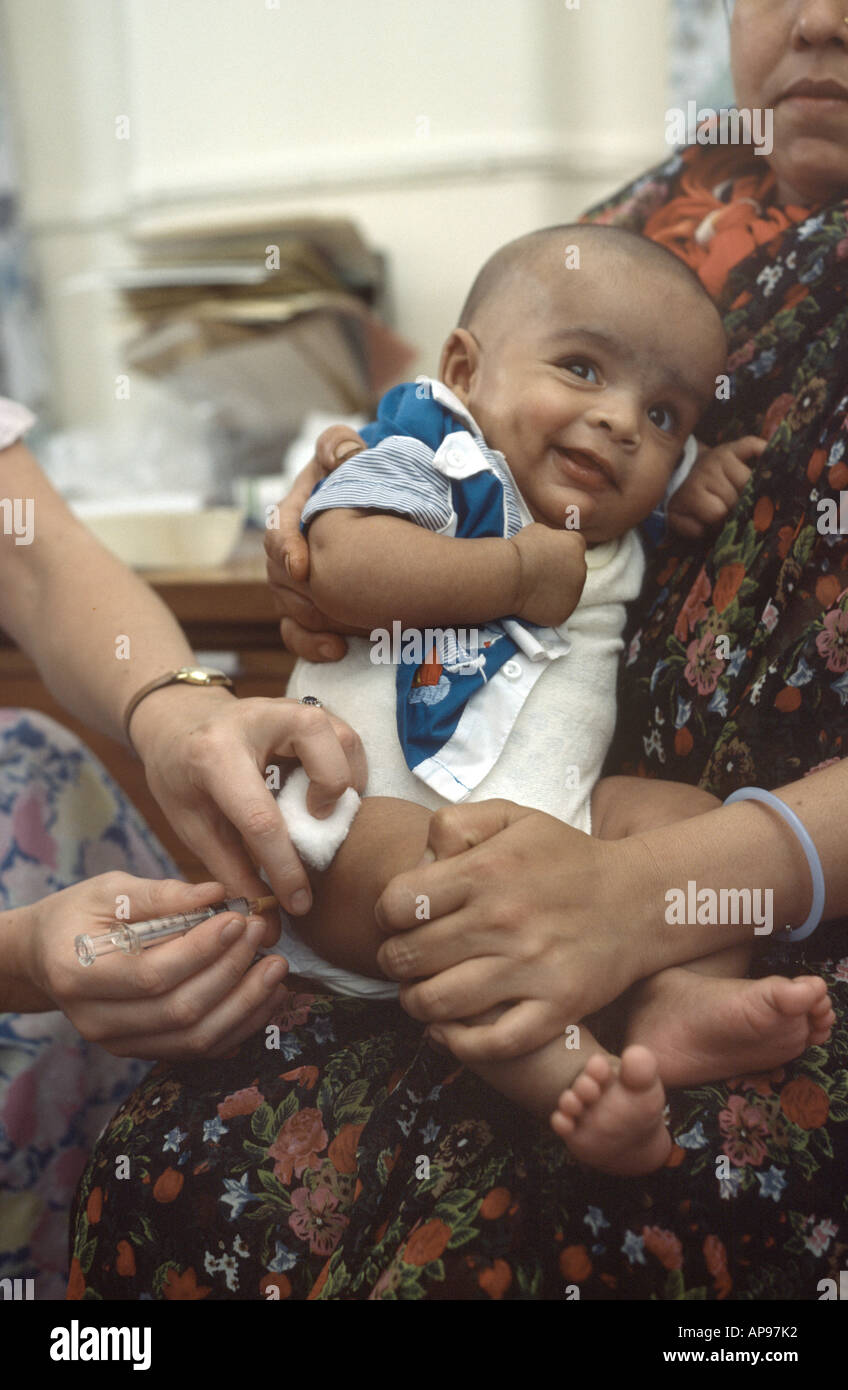 triple injection vaccination for four month baby Stock Photo - Alamy