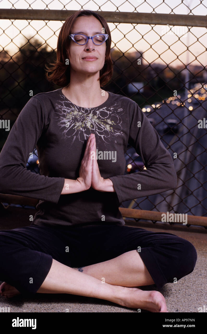 Woman doing yoga on a freeway overpass Stock Photo - Alamy