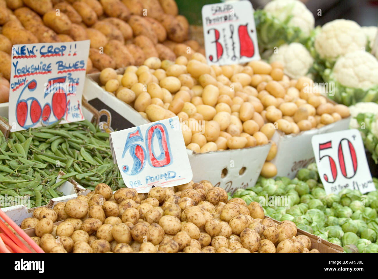 food on sale on market stall potatoes sprouts bean green cauliflower ...