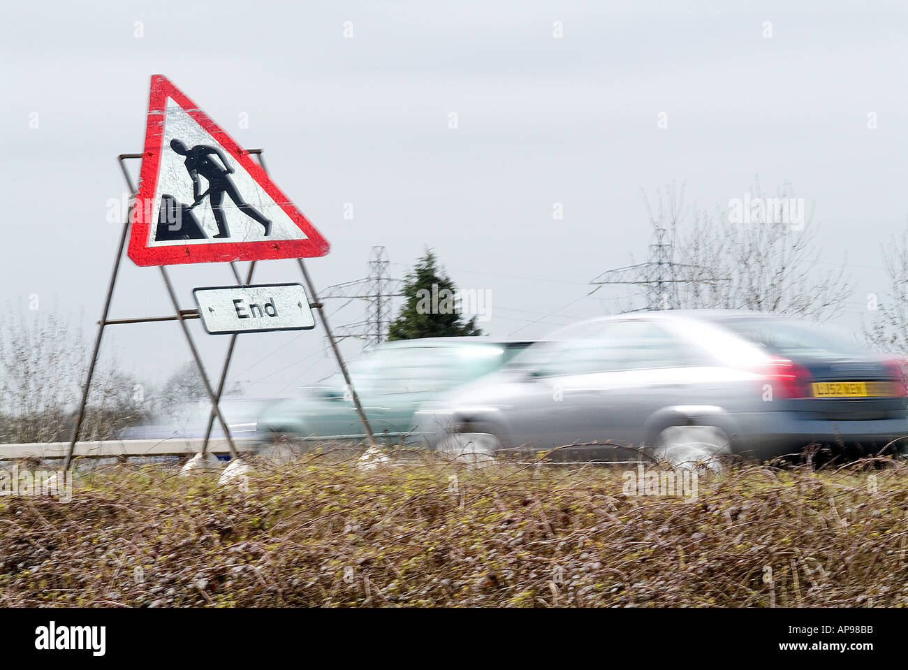 men at work hold up on motorway roadworks congestion que traffic jam ...