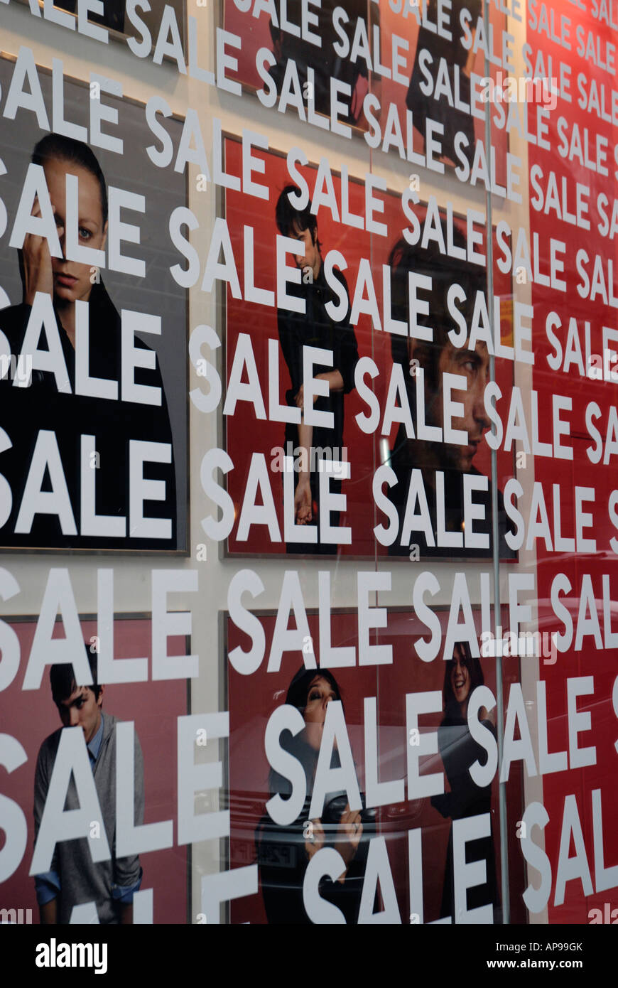 Sale signs in fashion store window Stock Photo - Alamy