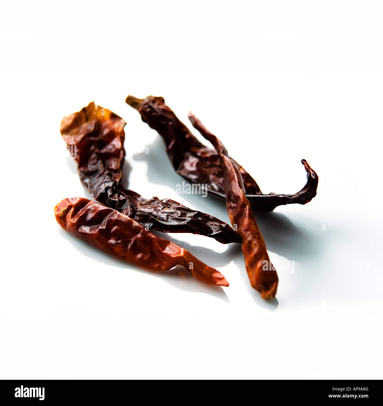 Dried Kashmiri red chillies on white background Stock Photo - Alamy