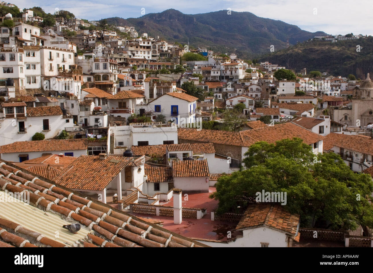A scenic view of the roof tops of the town of Taxco Mexico The colorful ...