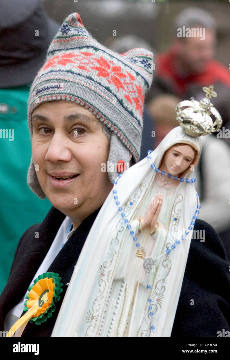 Woman carrying a madonna statue at the St Patrick's Day Parade, London ...