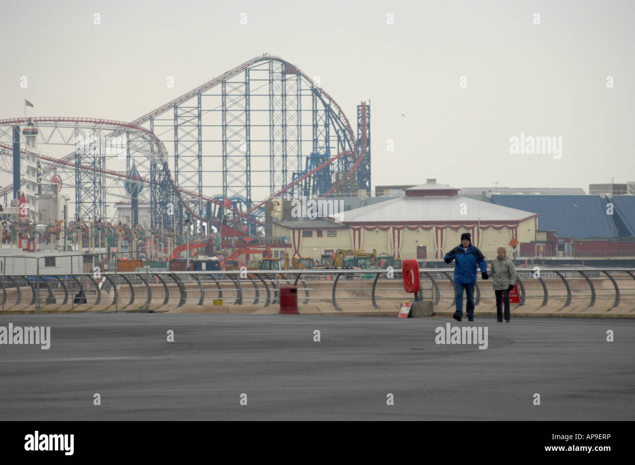 People enjoying a walk in windy conditions on the promenade in ...