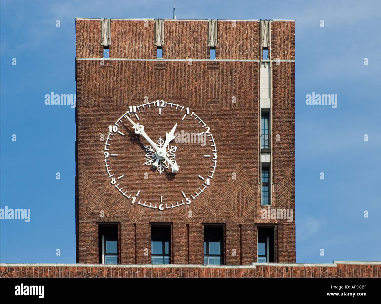 Closeup of clock on tower facing Oslo fjord Radhus City Hall Oslo ...