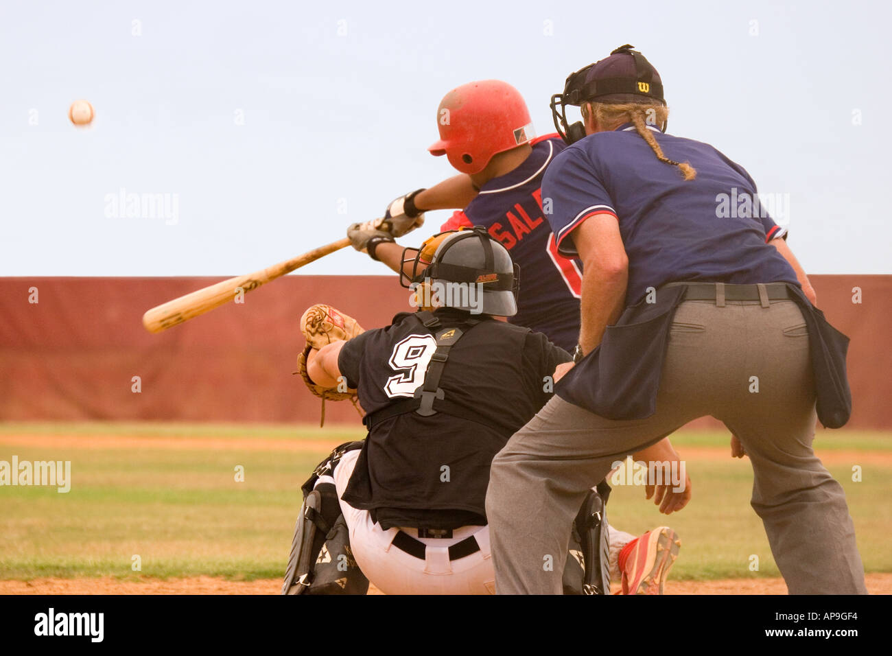 A classic baseball scene of a batter, catcher, and umpire, as the ...