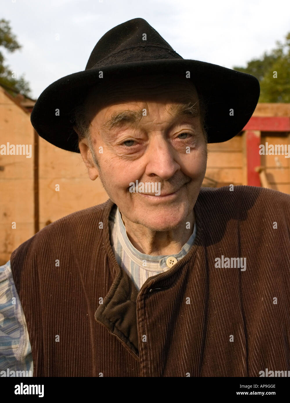 Model released portrait of an elderly man wearing traditional workers ...