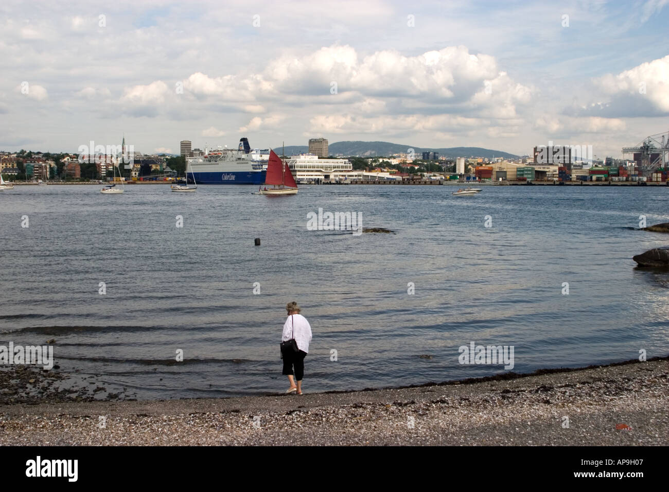Oslo Harbor from Bygdoy with woman standing on shore Oslo Norway Stock ...