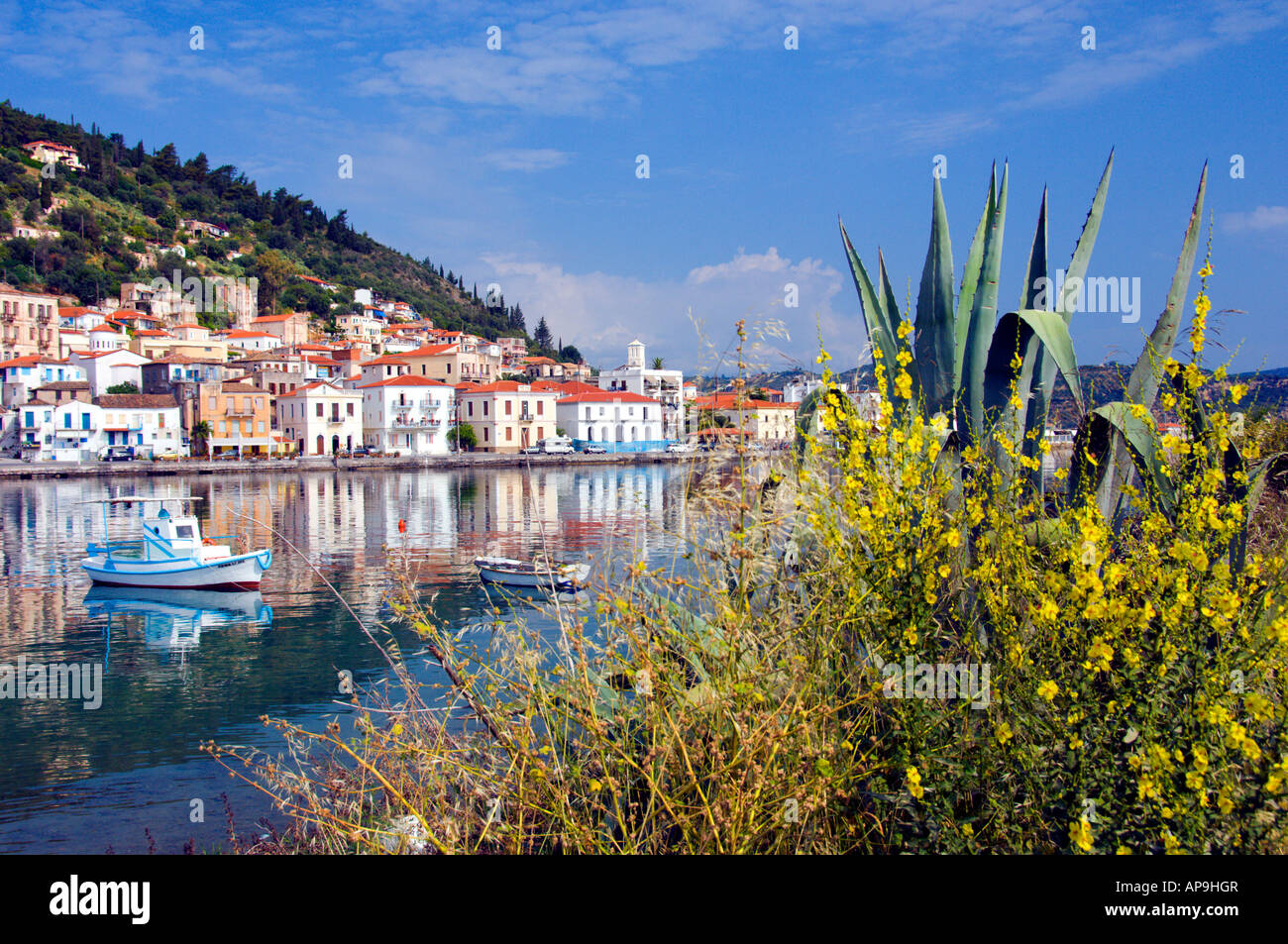 Pastel colored buildings on the waterfront and colorful fishing boats ...