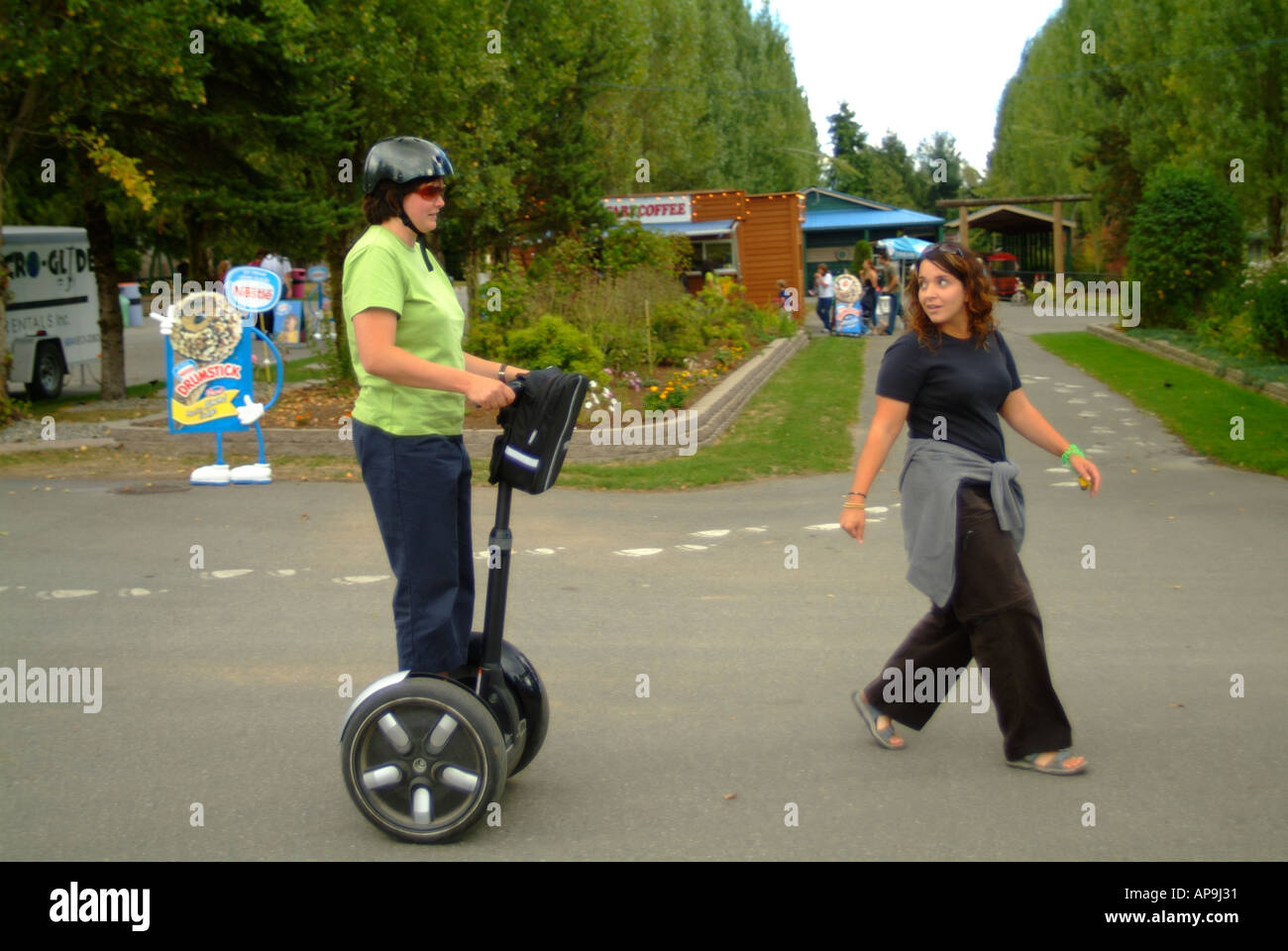 Woman riding on a Segway transporter Stock Photo - Alamy