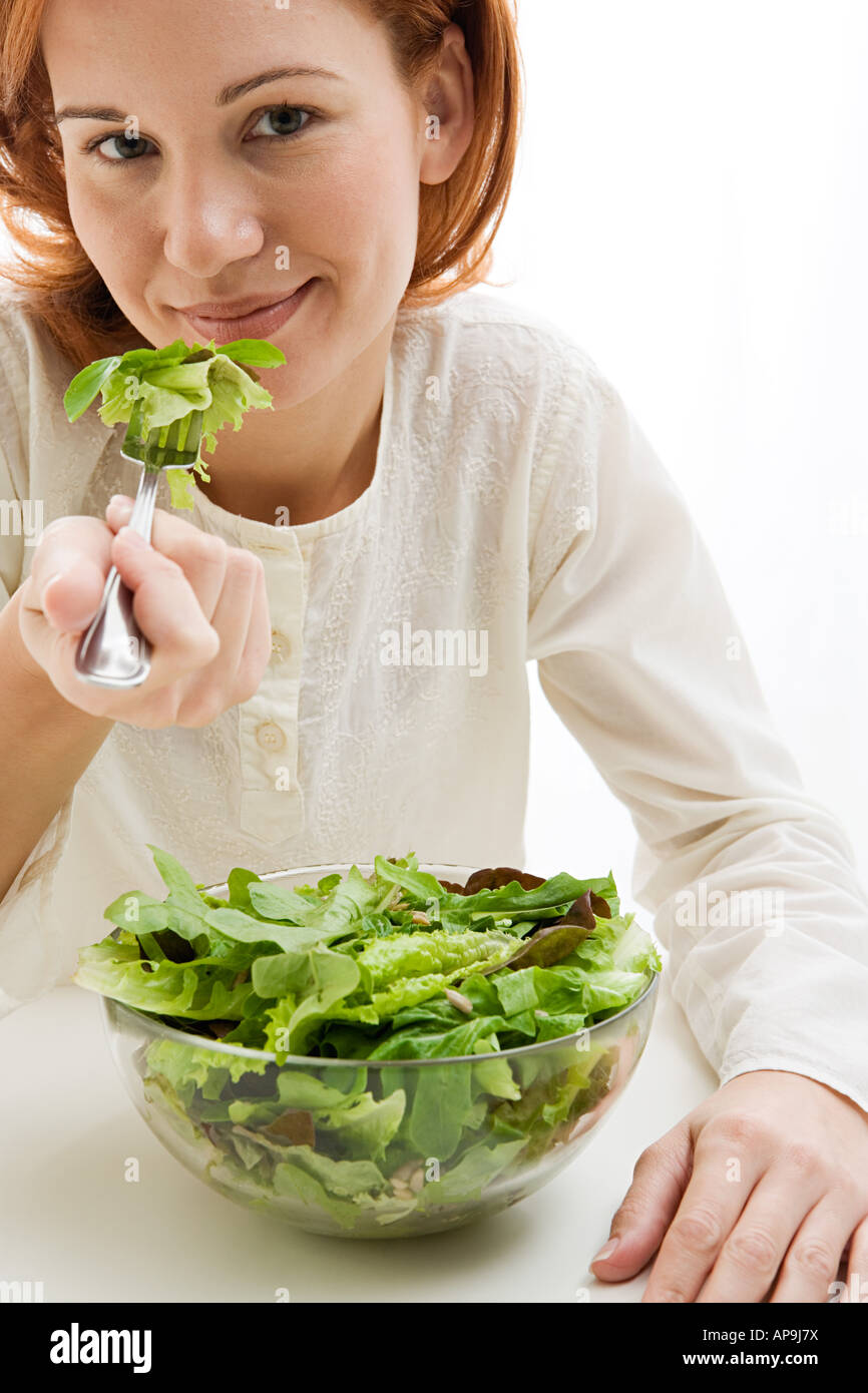 Woman eating lettuce Stock Photo - Alamy