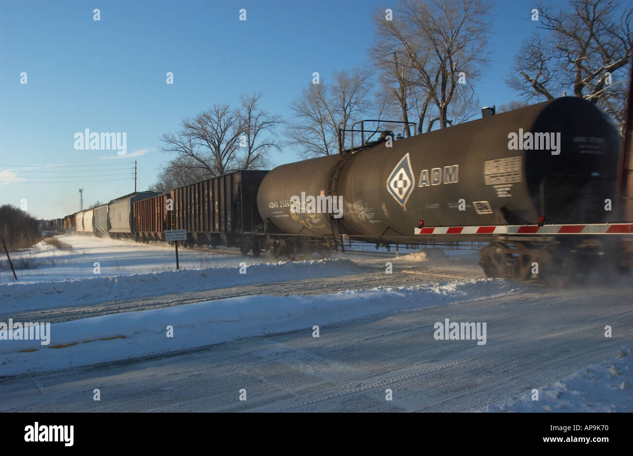freight trainSnowy and cold crisp and clear with blue sky tank cars ...